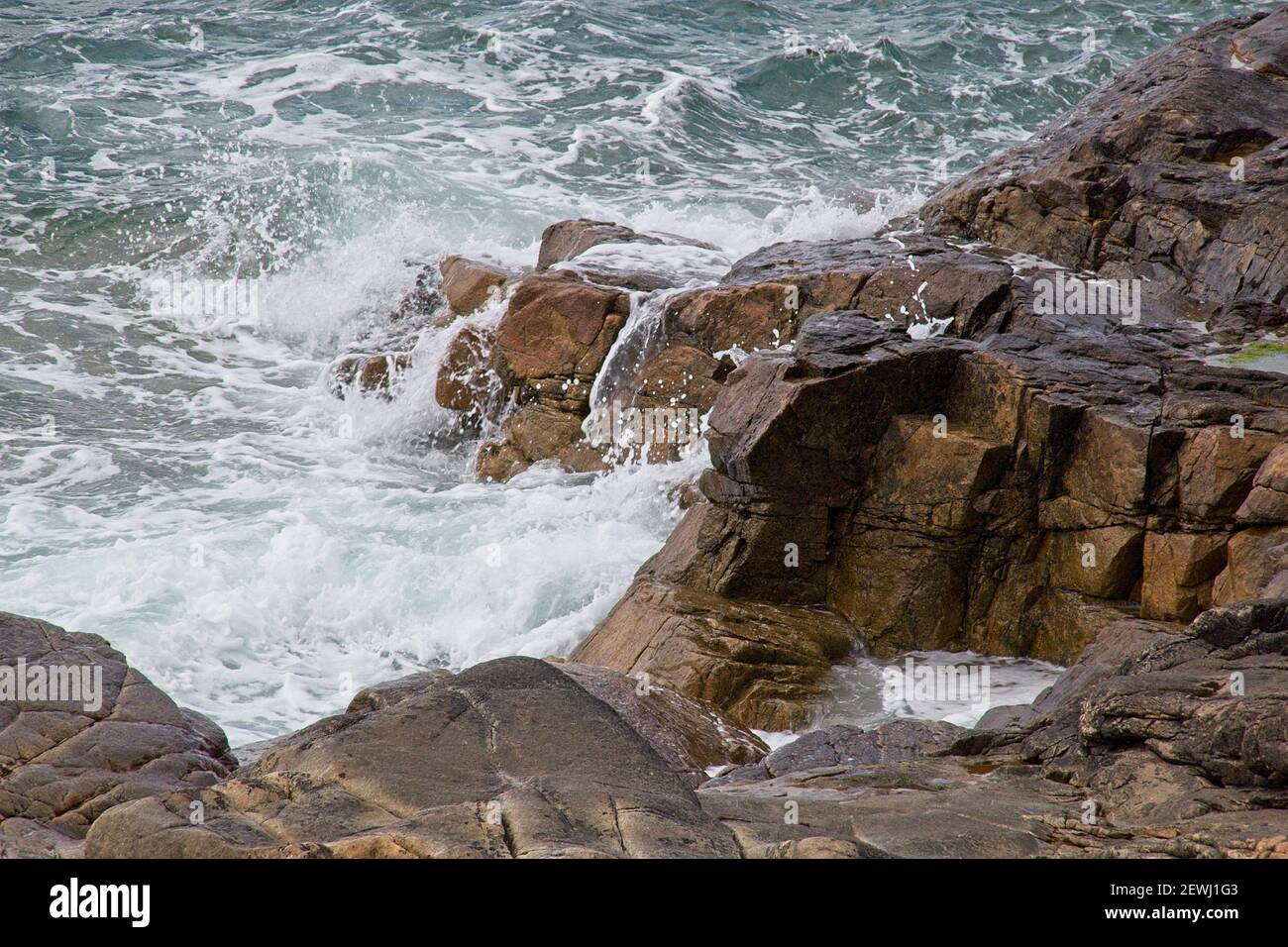 waves breaking on rocks Stock Photo - Alamy