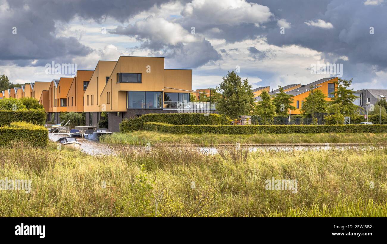 Neighborhood with ecological houses in natural setting in wild nature ...