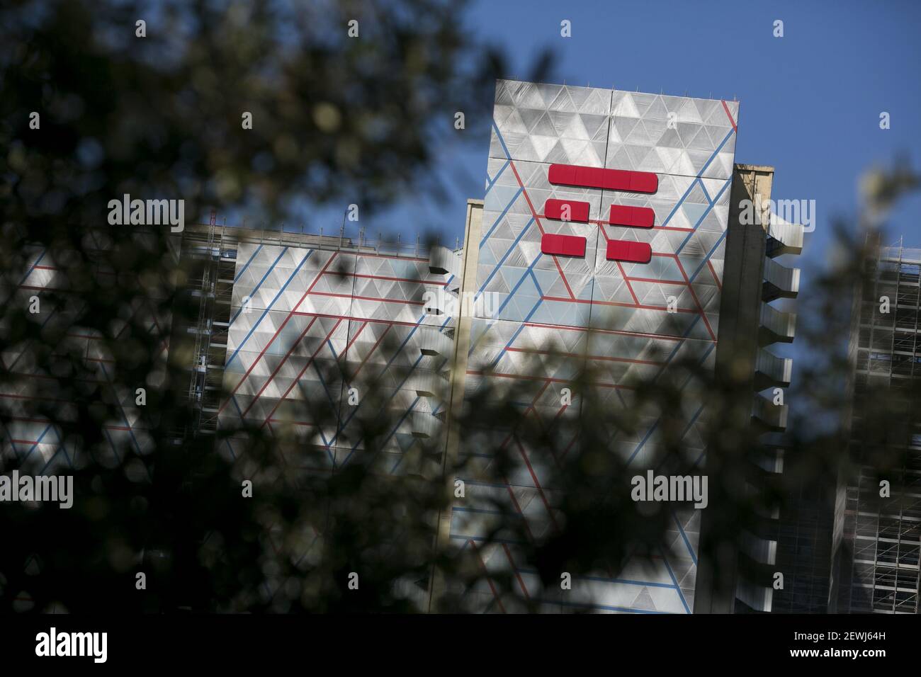 A logo sign outside of the future headquarters of Telecom Italia (TIM ...