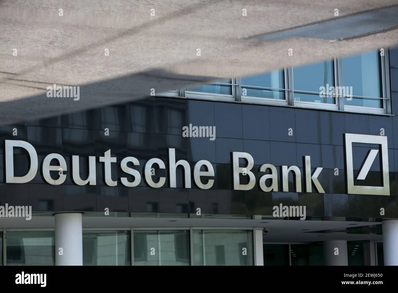 A logo sign outside of facility occupied by Deutsche Bank in Milan ...