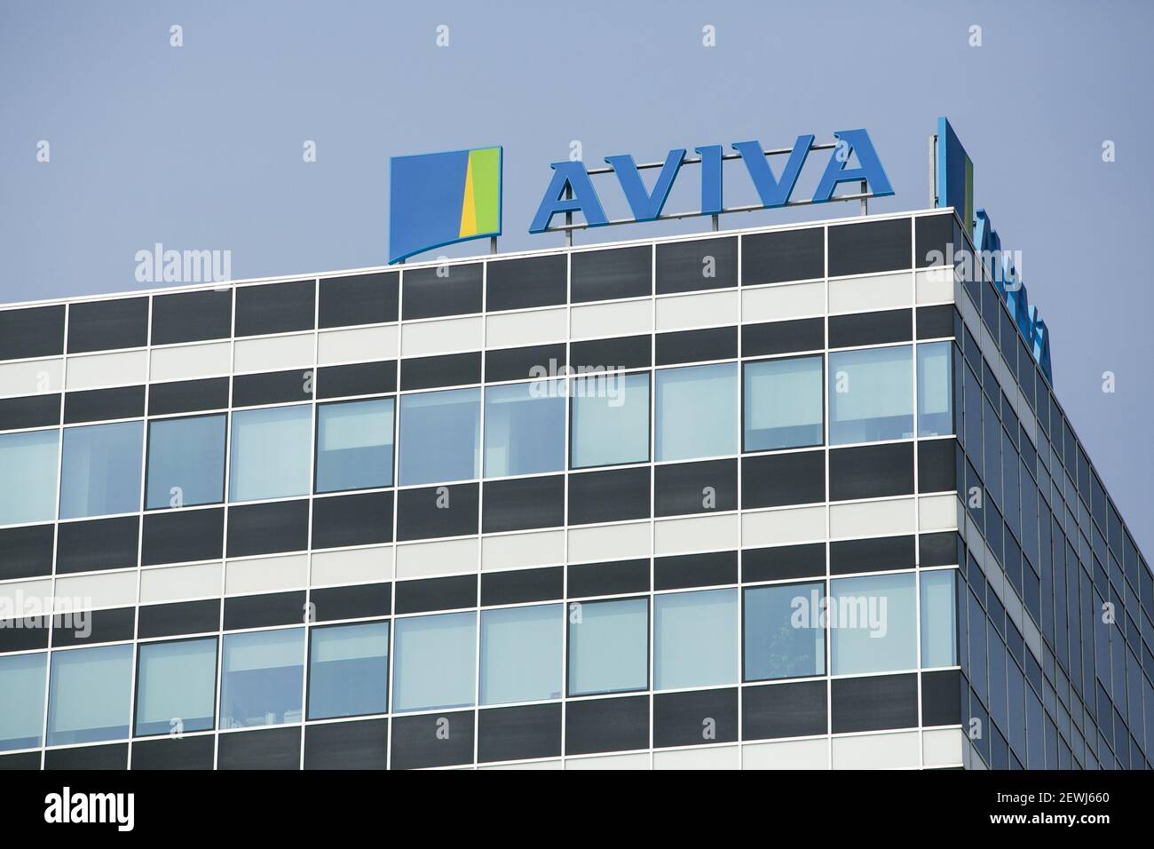 A logo sign outside of a facility occupied by Aviva in Milan, Italy on ...