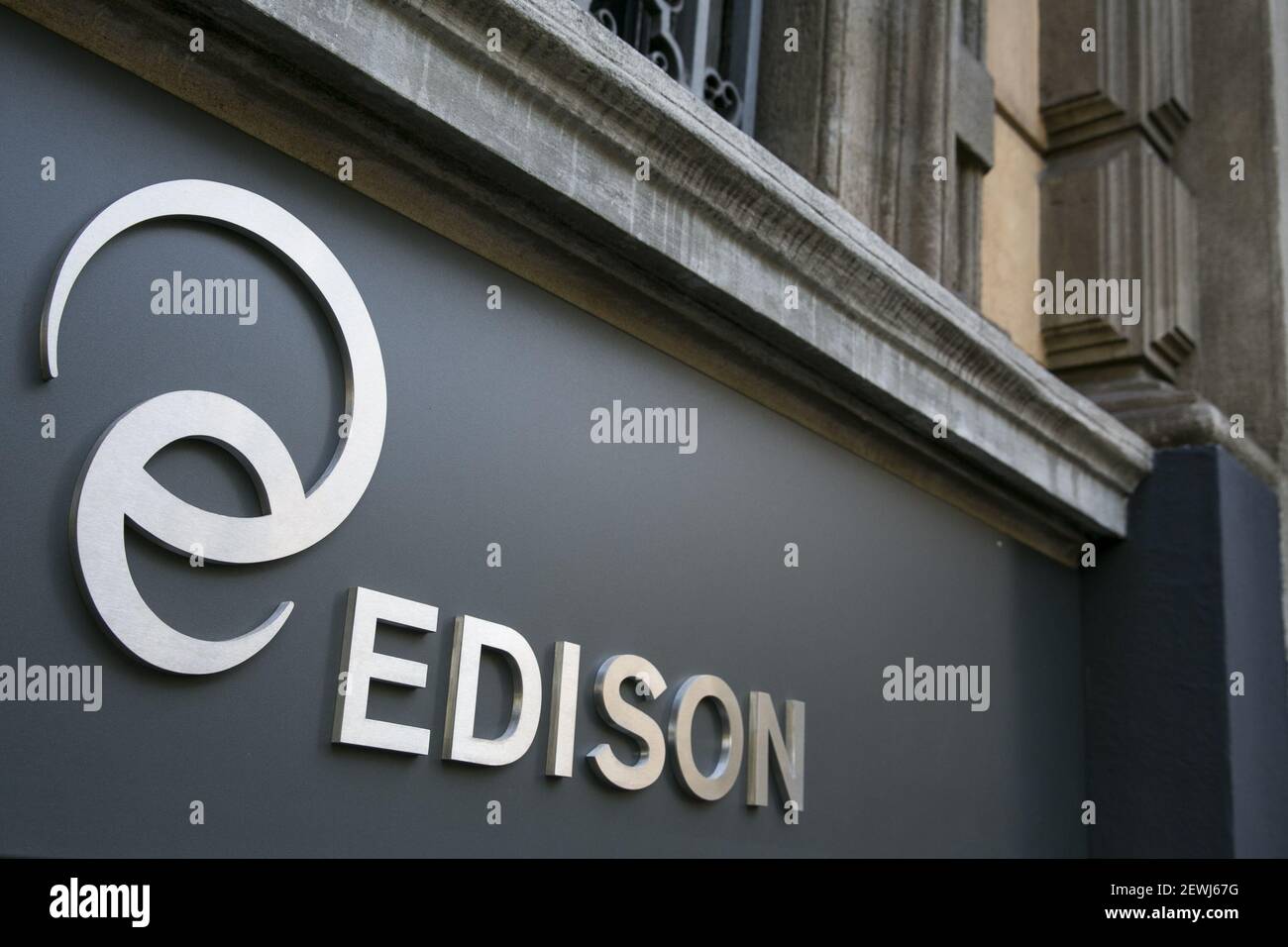 A logo sign outside of the headquarters of Edison S.p.A. in Milan ...