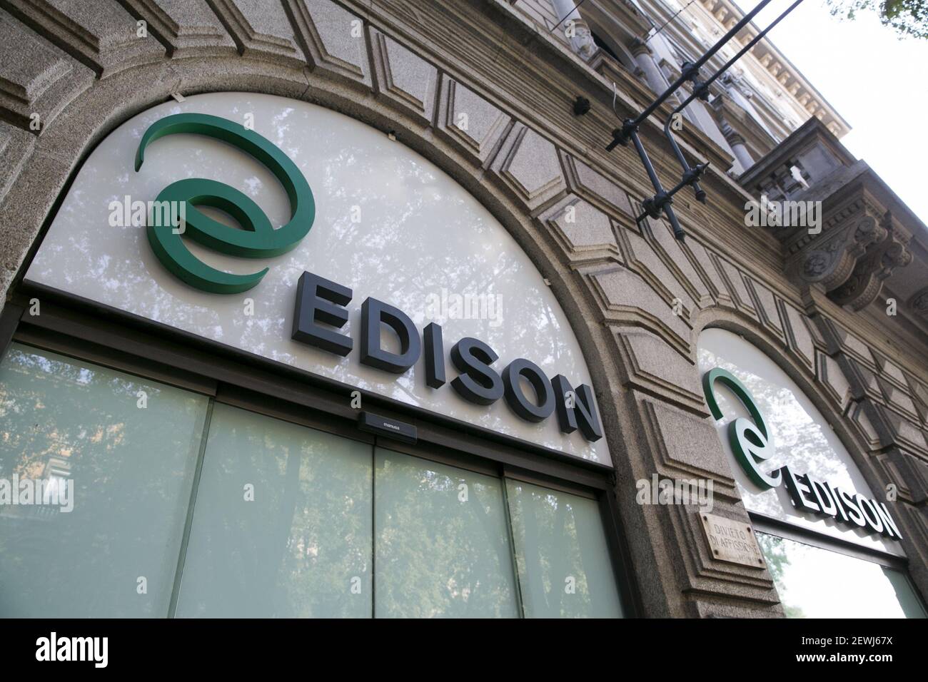 A logo sign outside of the headquarters of Edison S.p.A. in Milan ...