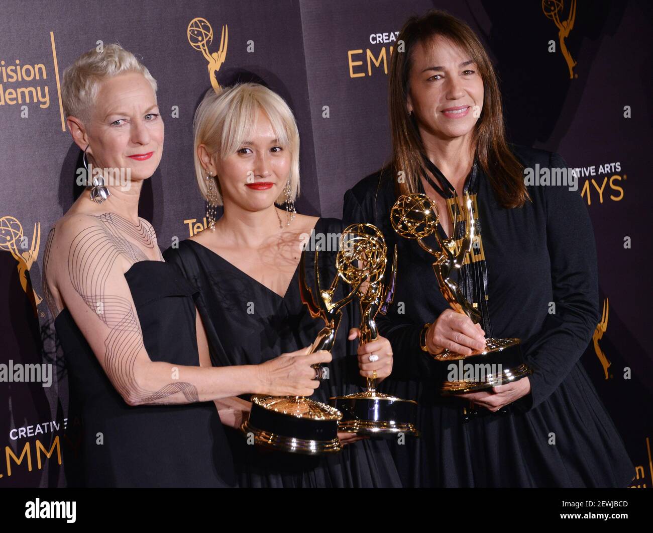 (L-R) Lou Eyrich, Helen Huang and Marisa Aboitiz pose in the press room ...