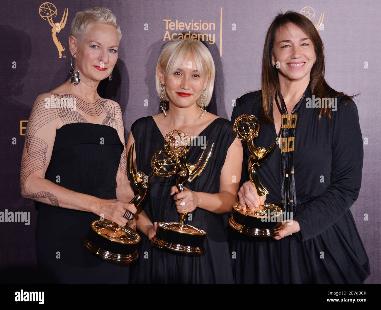 (L-R) Lou Eyrich, Helen Huang and Marisa Aboitiz pose in the press room ...