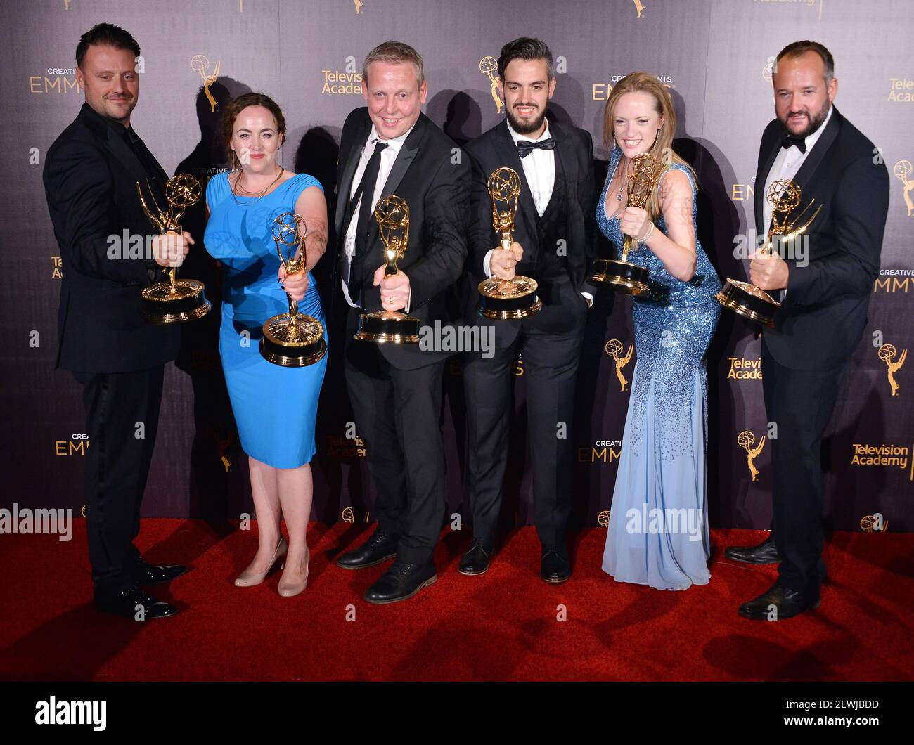 The team of Sherlock poses in the press room with their awards for ...