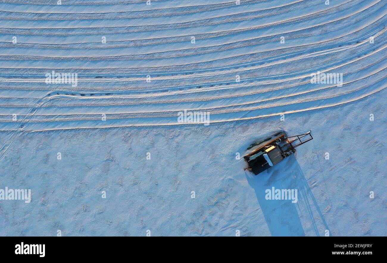 After a heavy snowfall, area along Songhua River is frozen in Harbin ...