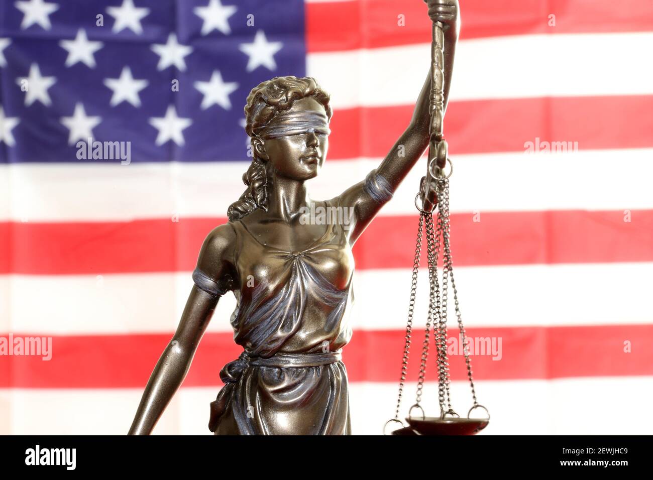 Symbol image: Justitia in front of a USA flag Stock Photo - Alamy