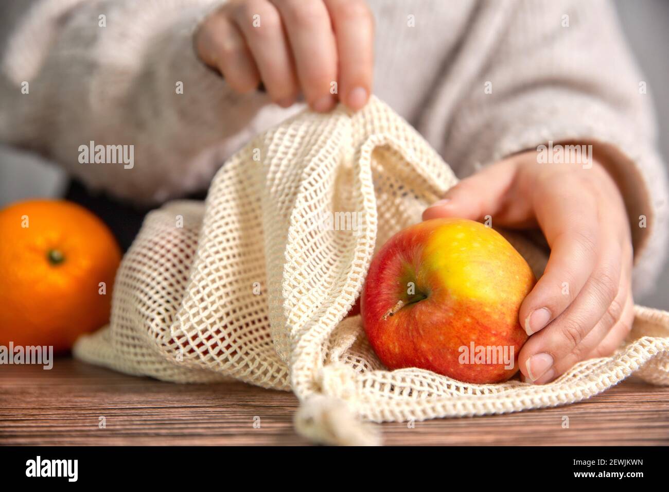 Net bag oranges apples hi-res stock photography and images - Alamy