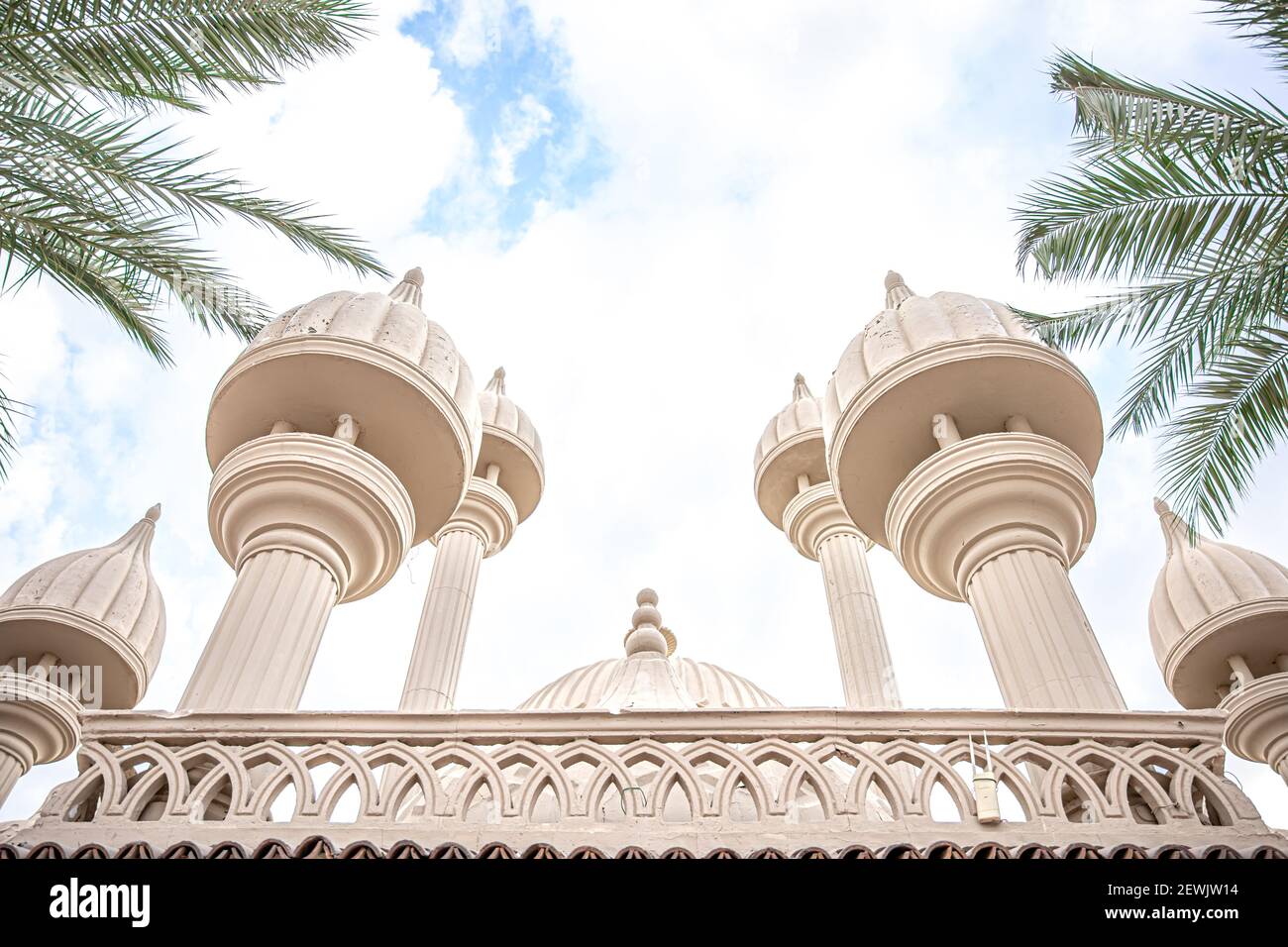 Traditional Islamic mosque among the palm trees in sunny weather Stock ...
