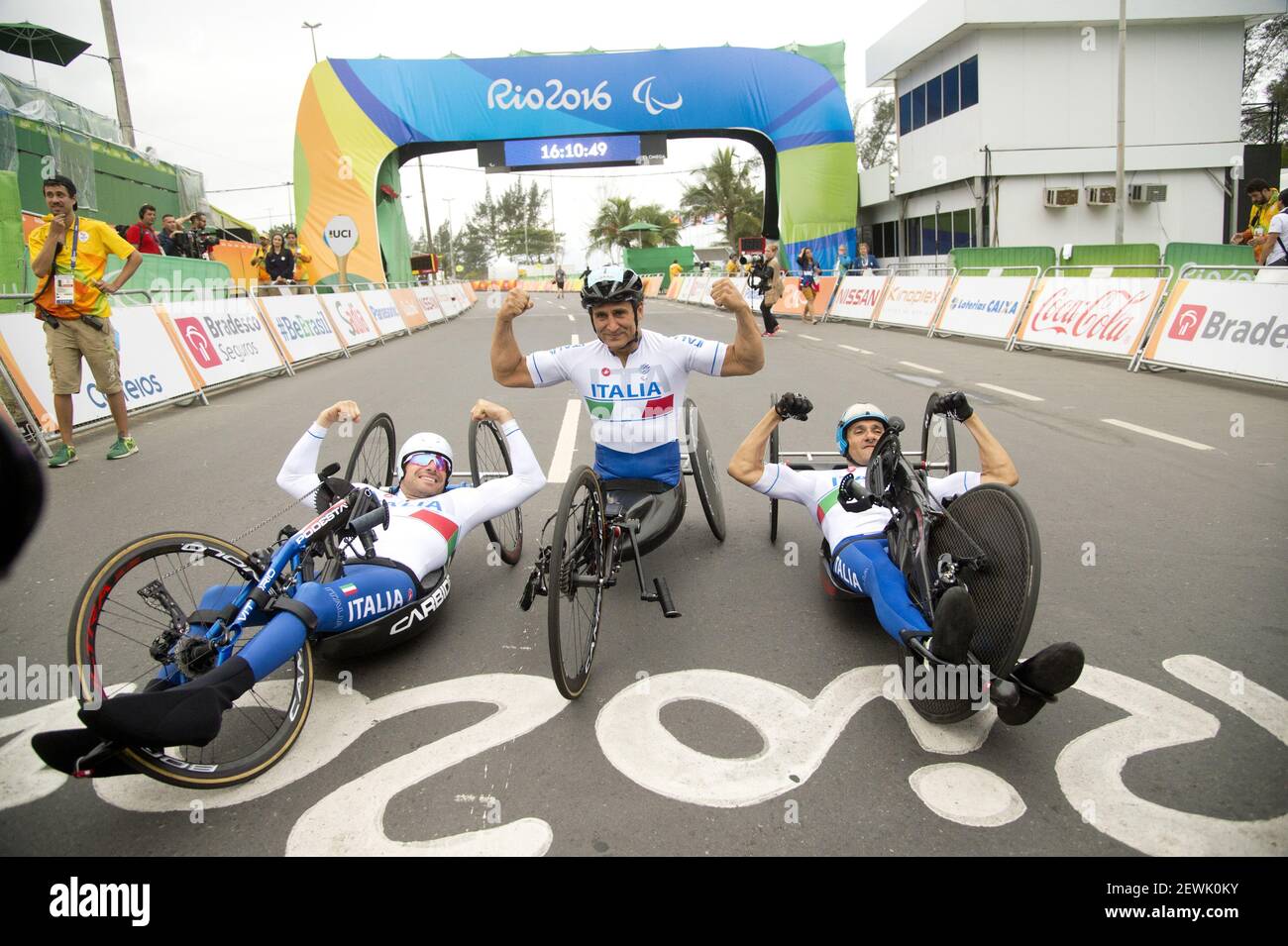 Alex Zanardi(C) and teammates Vittorio Podesta(L) and Luca Mazzone(R ...