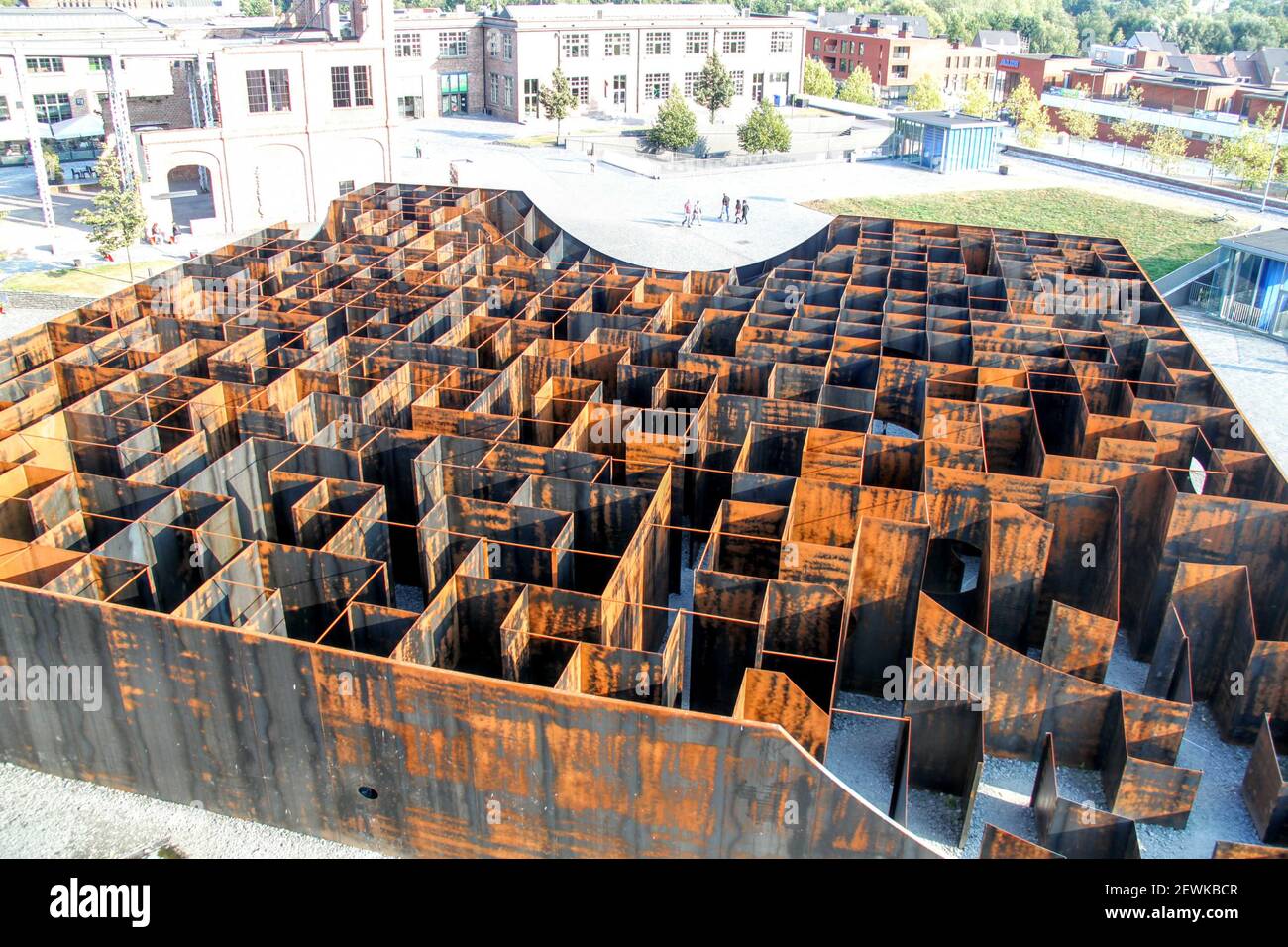 Visitors walk past "Labyrinth", an experimental metal maze installation ...
