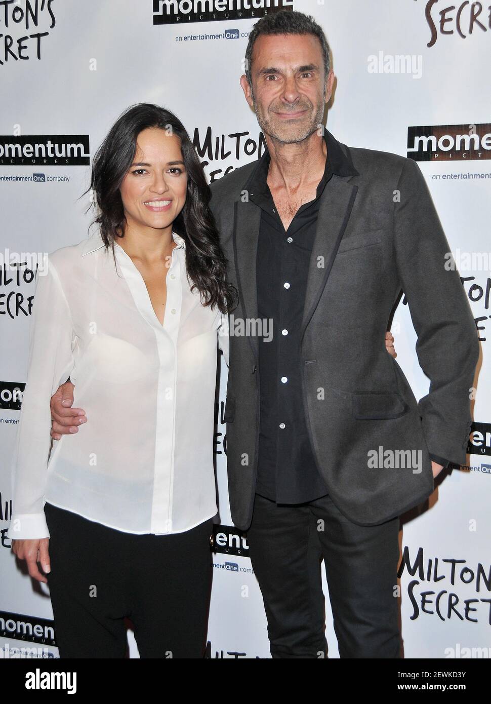 (L-R) Michelle Rodriguez and Director/Writer Barnet Bain arrives at ...