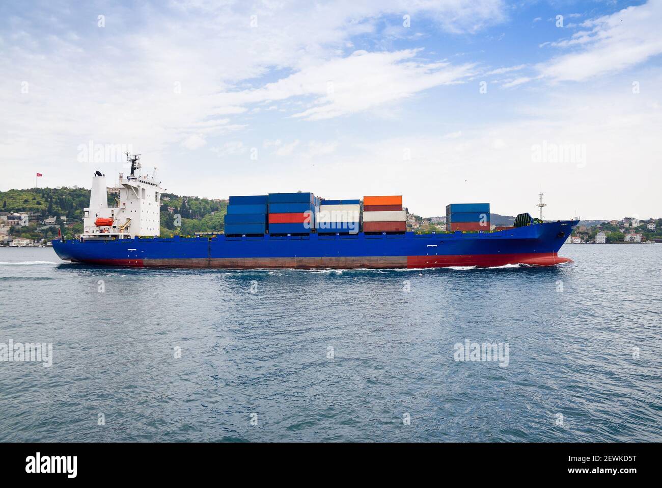 A large blue cargo ship with containers. Bosphorus, Istanbul, Turkey ...