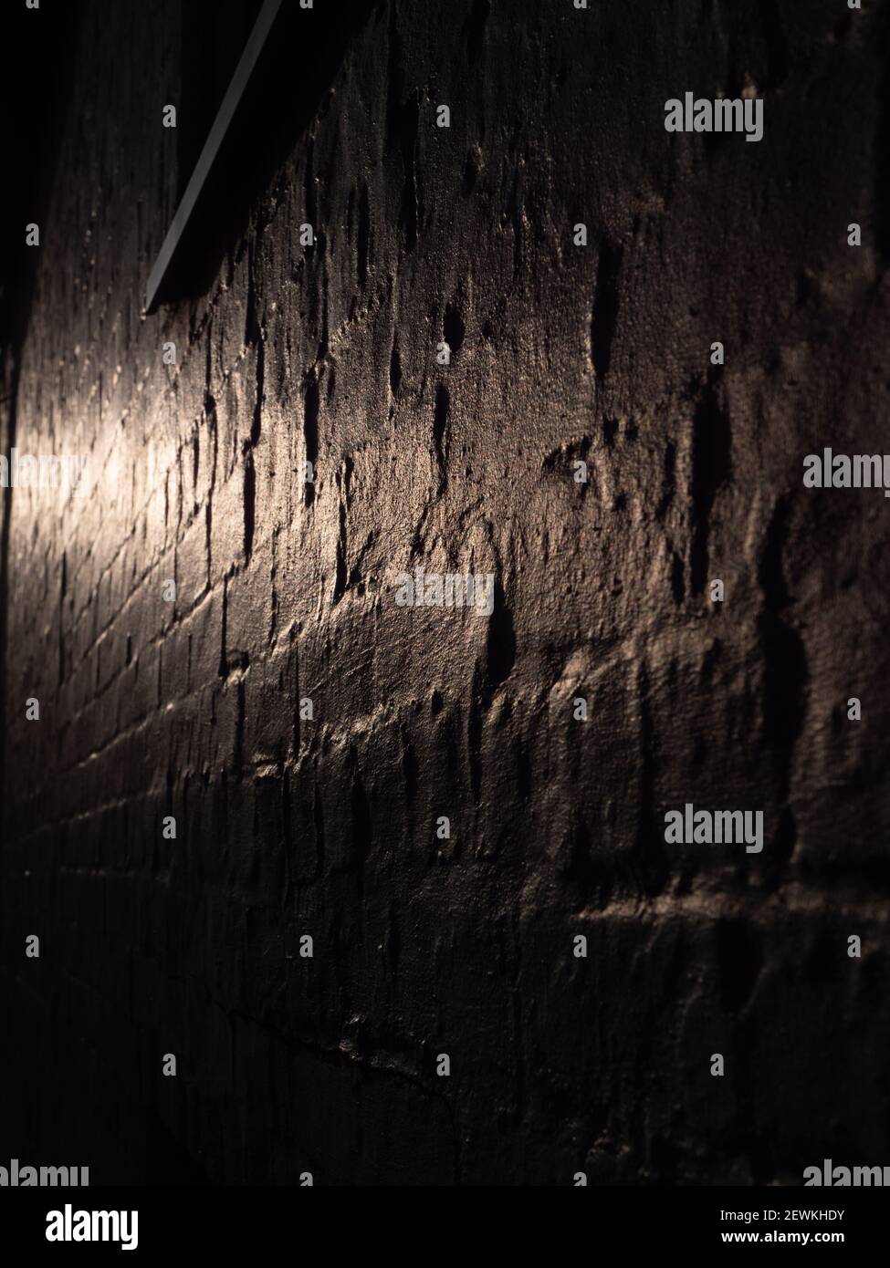 A painted brick wall reflecting light Stock Photo - Alamy
