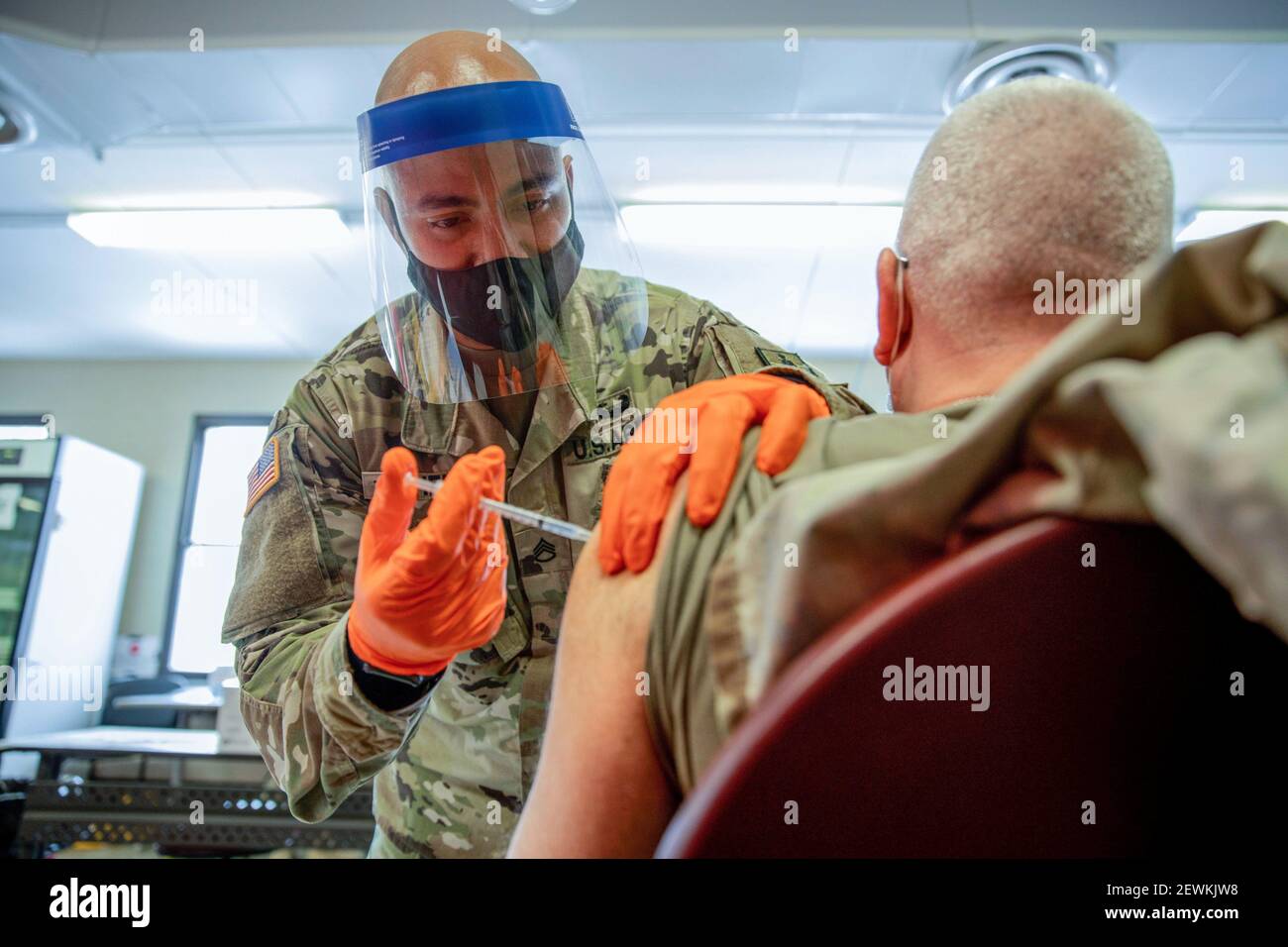 U. S. Army Staff Sgt. Nigel Chen, assigned to Joint Task Force COVID-19 ...