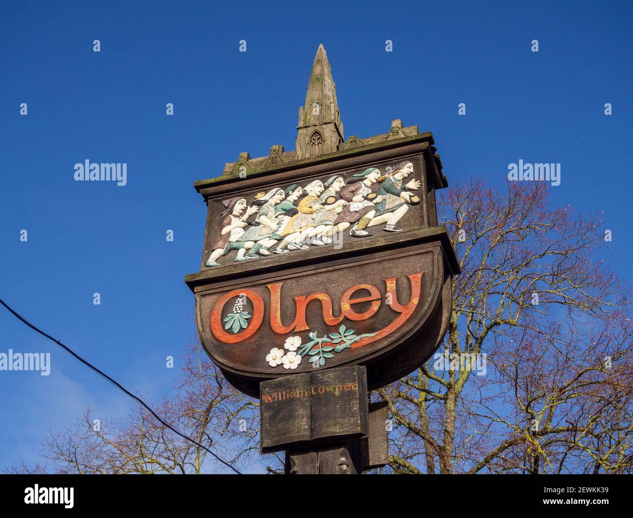 Carved wooden and painted town sign for Olney, Buckinghamshire, UK ...