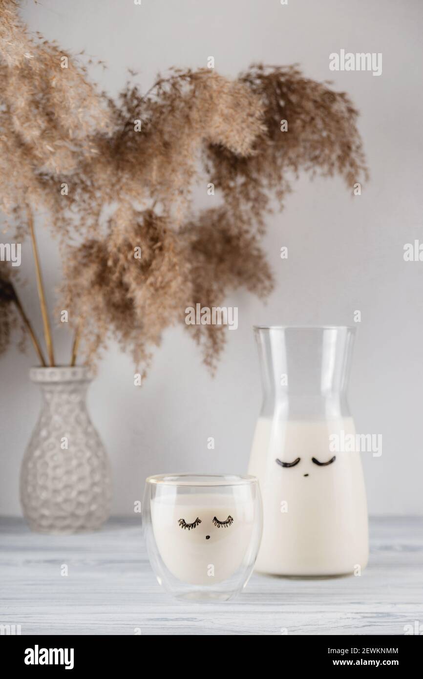 Malted nighttime milk for good sleep in a jar and glass with closed ...