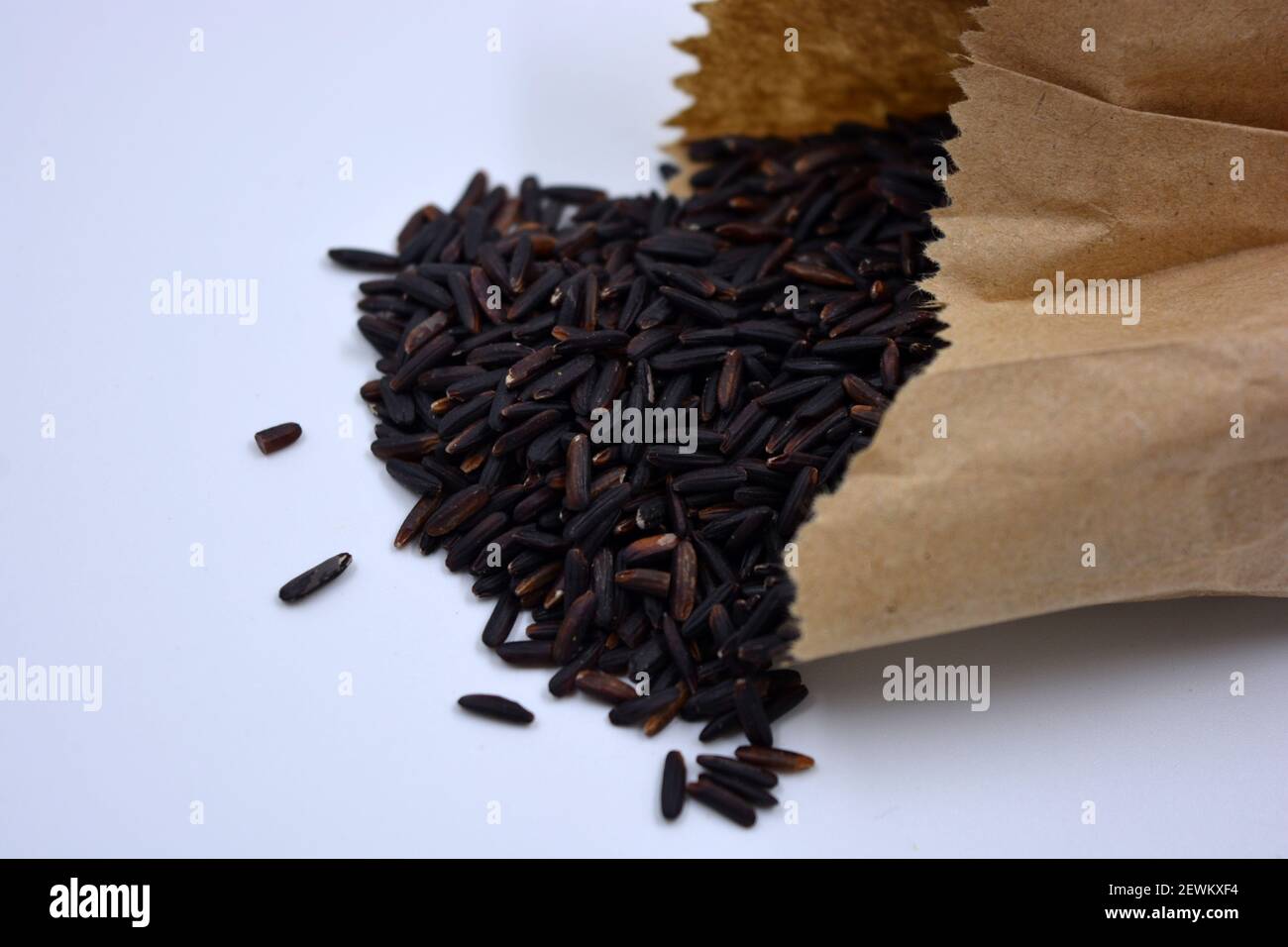 Wild unwanted handsome black rice raised on a white background Stock ...