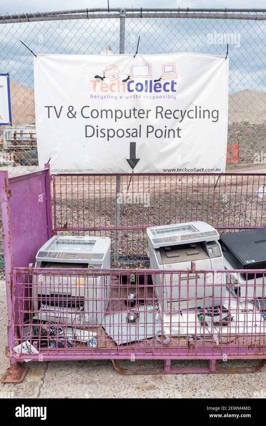 Computer, printers and televisions stacked ready for collection and ...