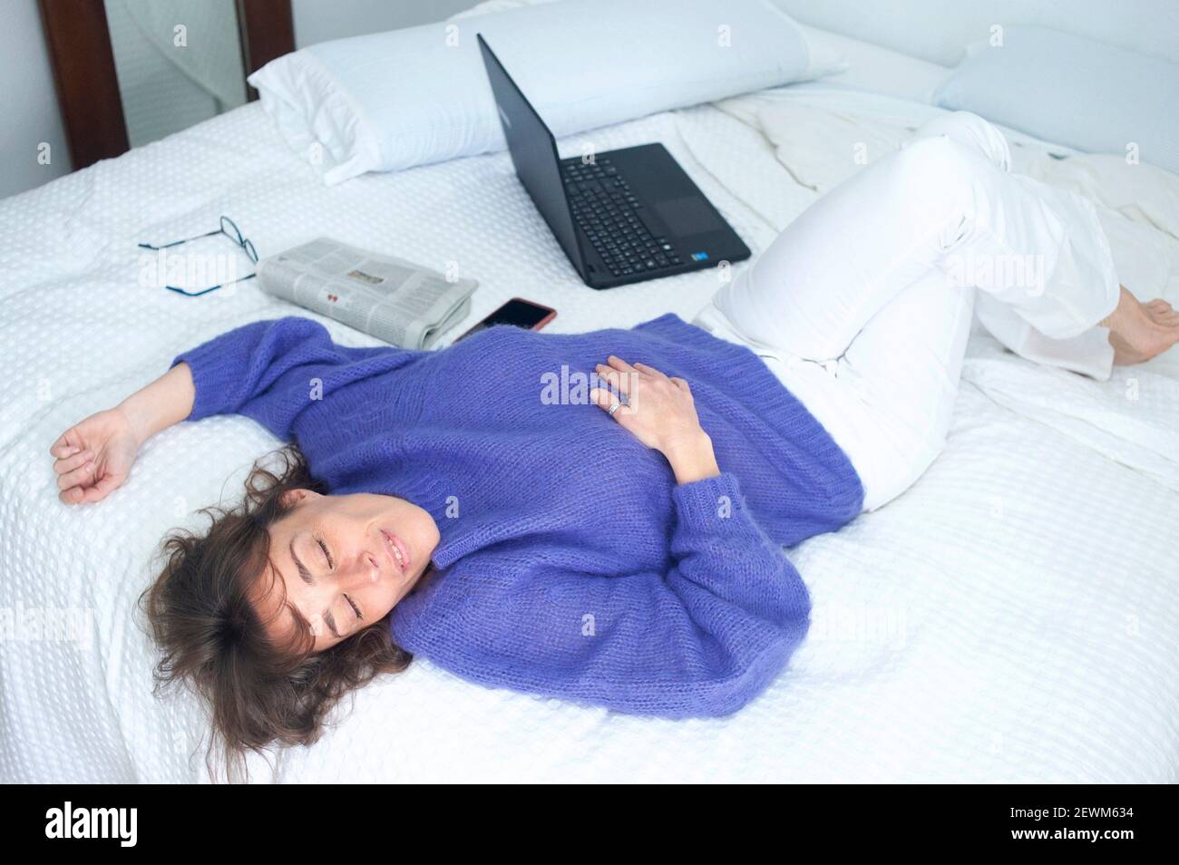 Beautiful young woman laying down hi-res stock photography and images ...