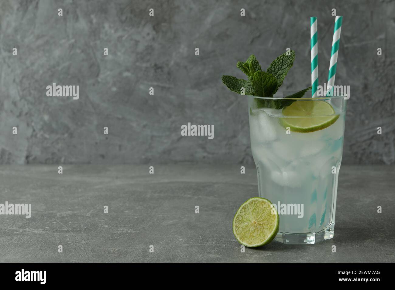 Glass of mojito cocktail on gray table Stock Photo - Alamy