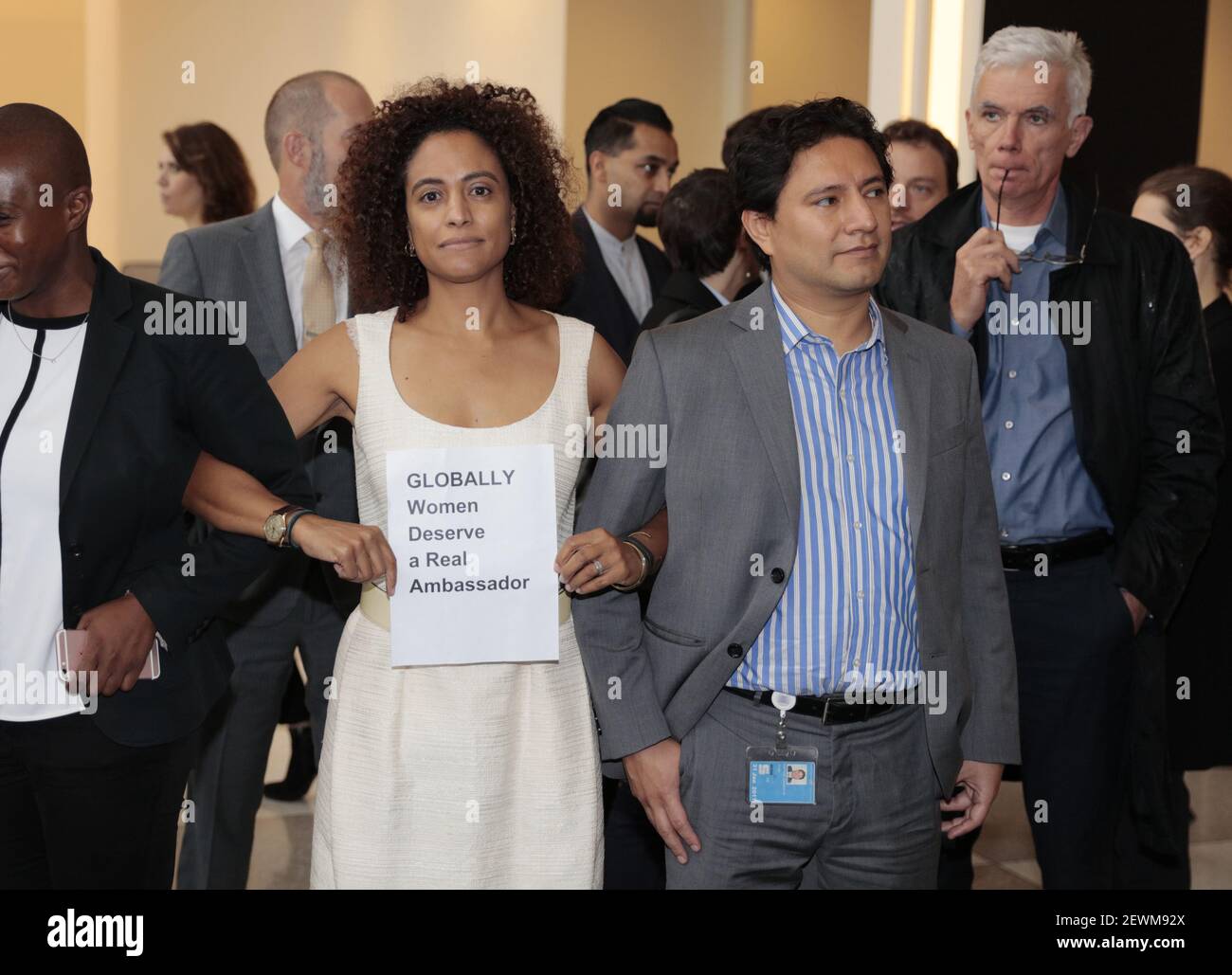 United Nations staff stand in a silent protest, during a U.N. meeting ...