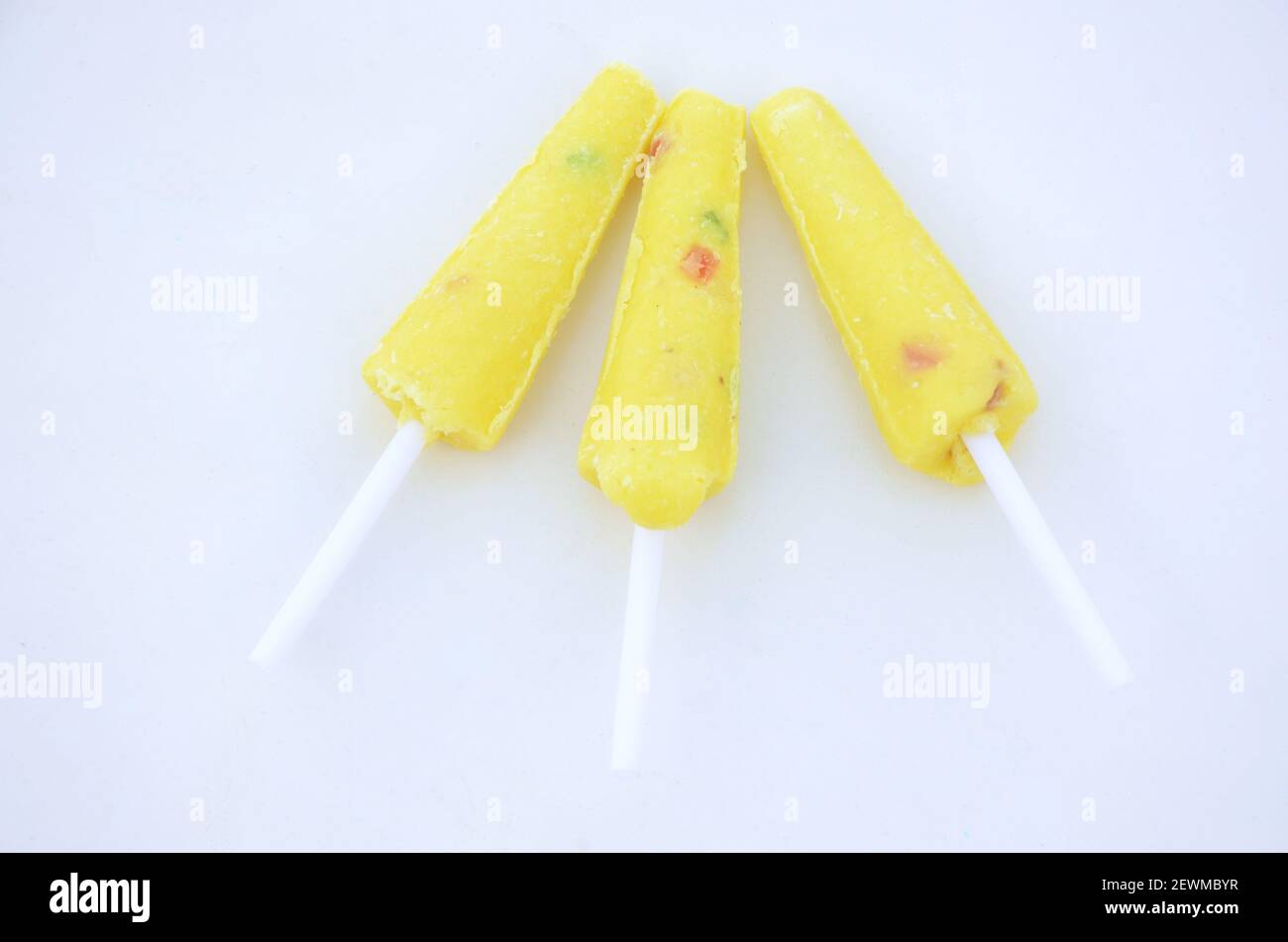 The sweet yellow cream lollypop isolated on white background Stock ...
