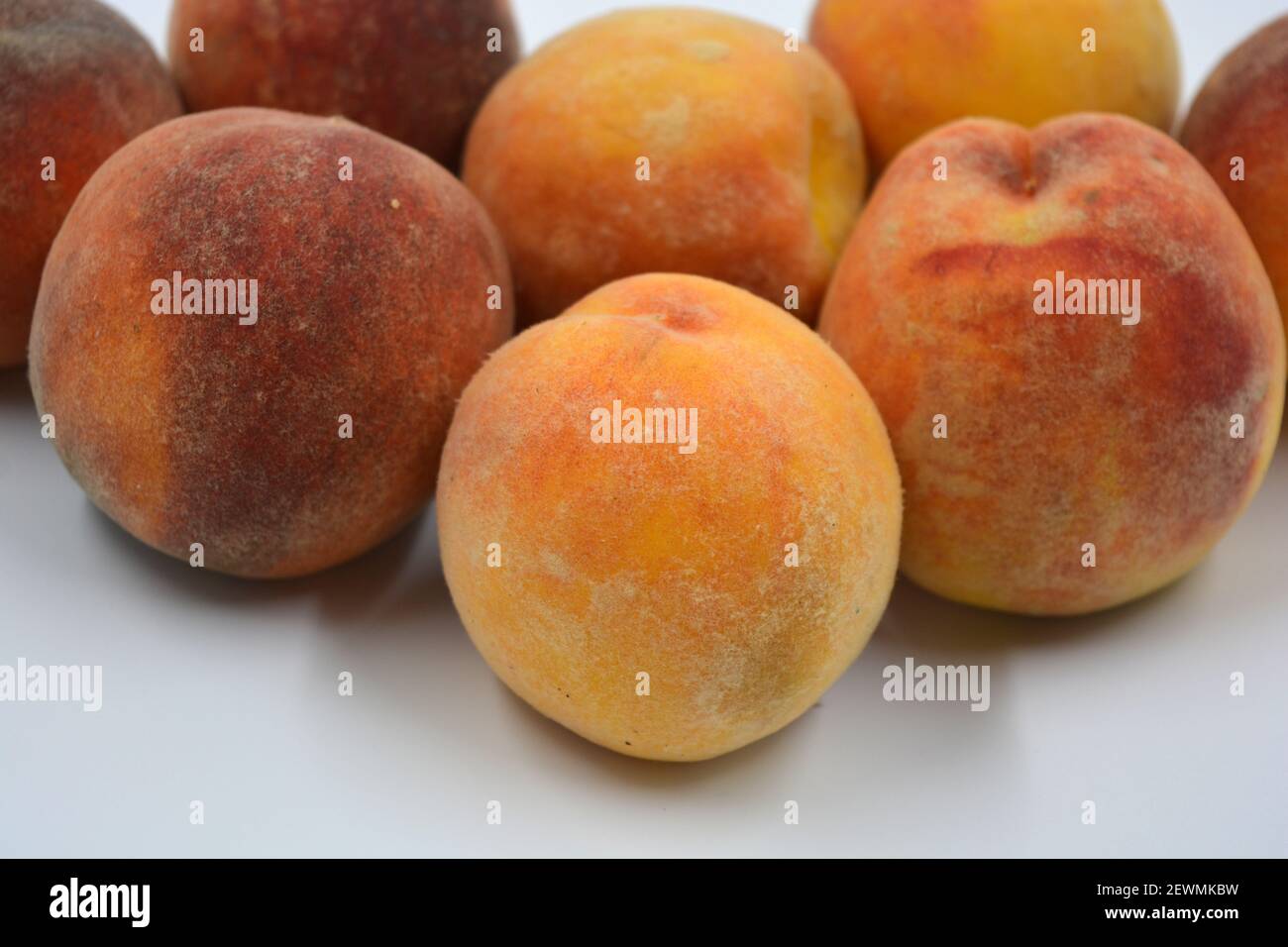 Tasty and useful fresh fruits, ripe red and orange peaches with a terry ...