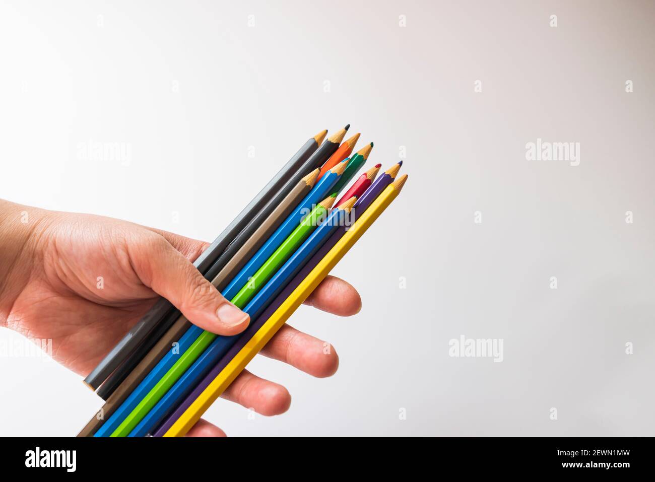 Side view with colored pencils close-up macro shot on white background ...