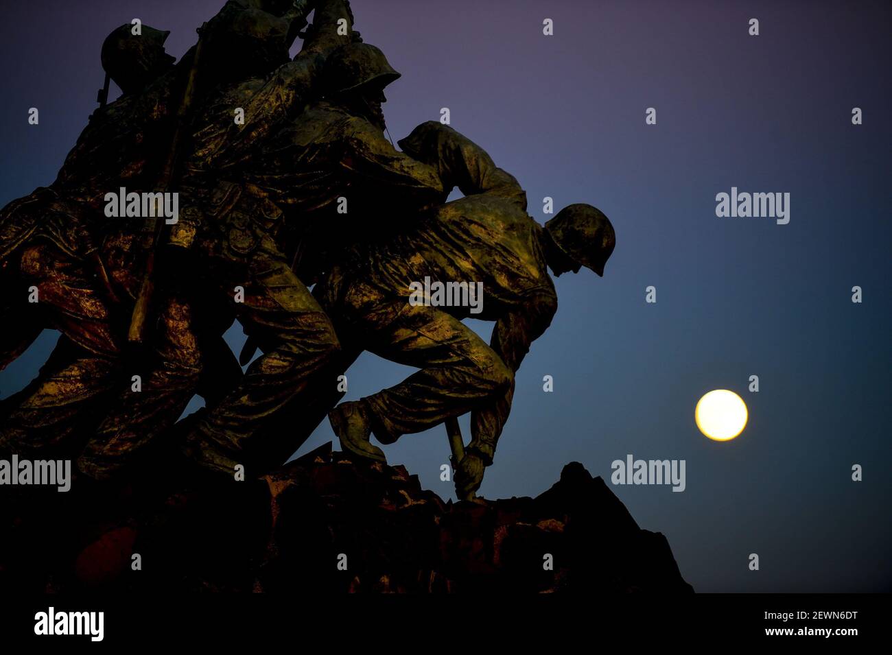 A supermoon rises over The United States Marine Corps War Memorial, in ...