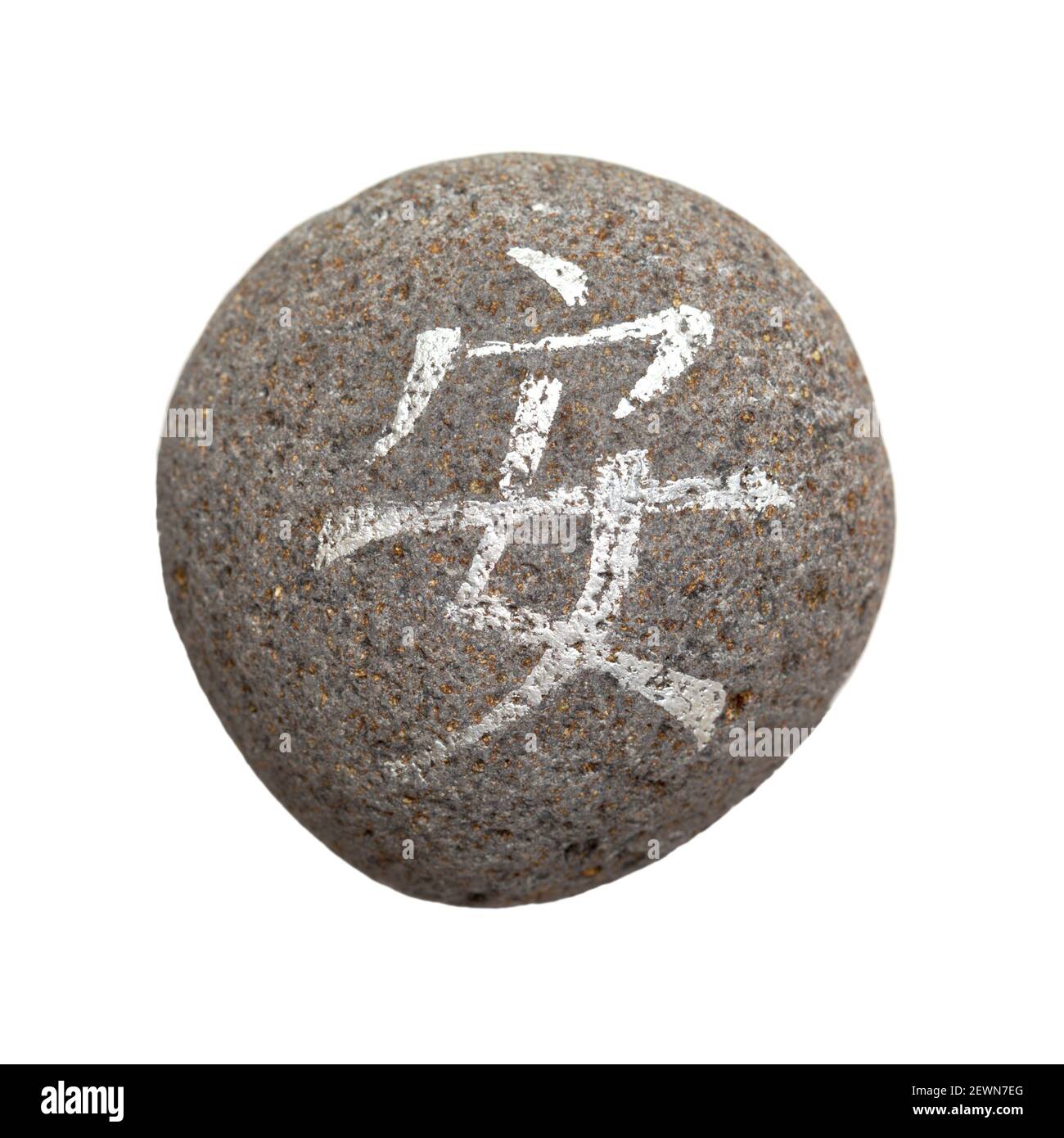 Chinese character an, meaning calm written on a volcanic rock pebble ...