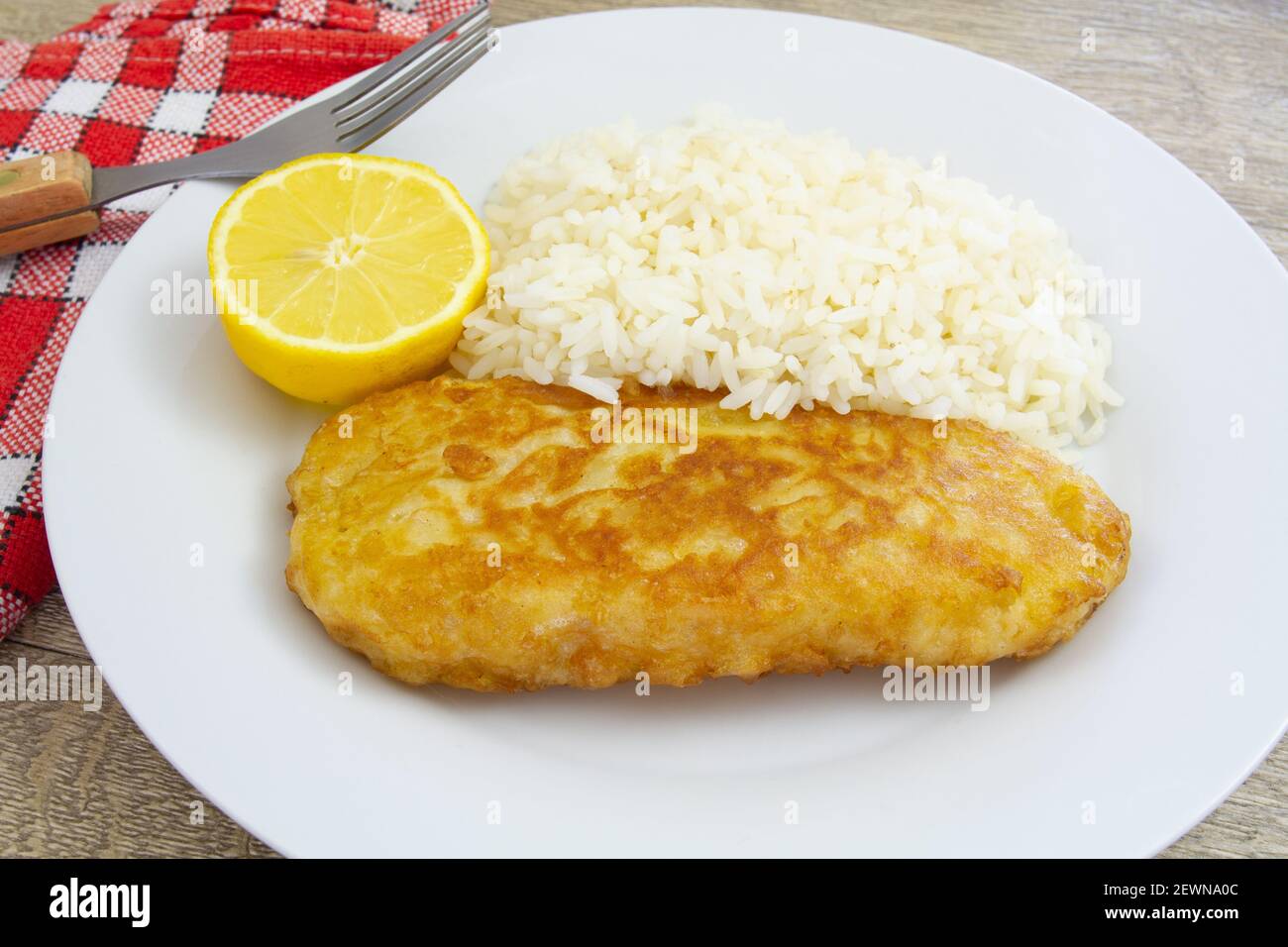 breaded fish with rice Stock Photo - Alamy