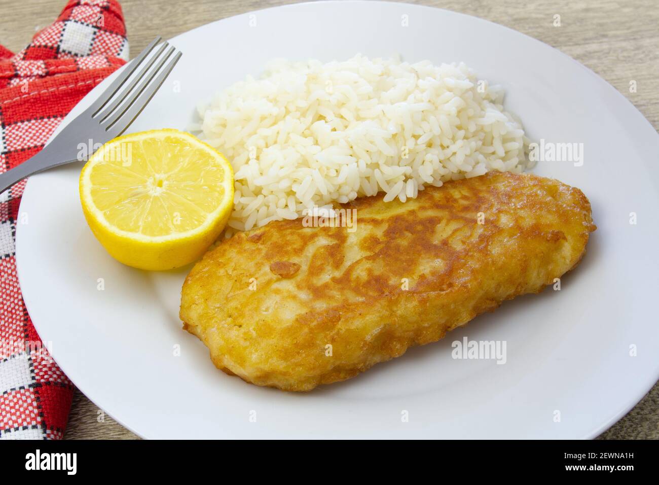 breaded fish with rice Stock Photo - Alamy