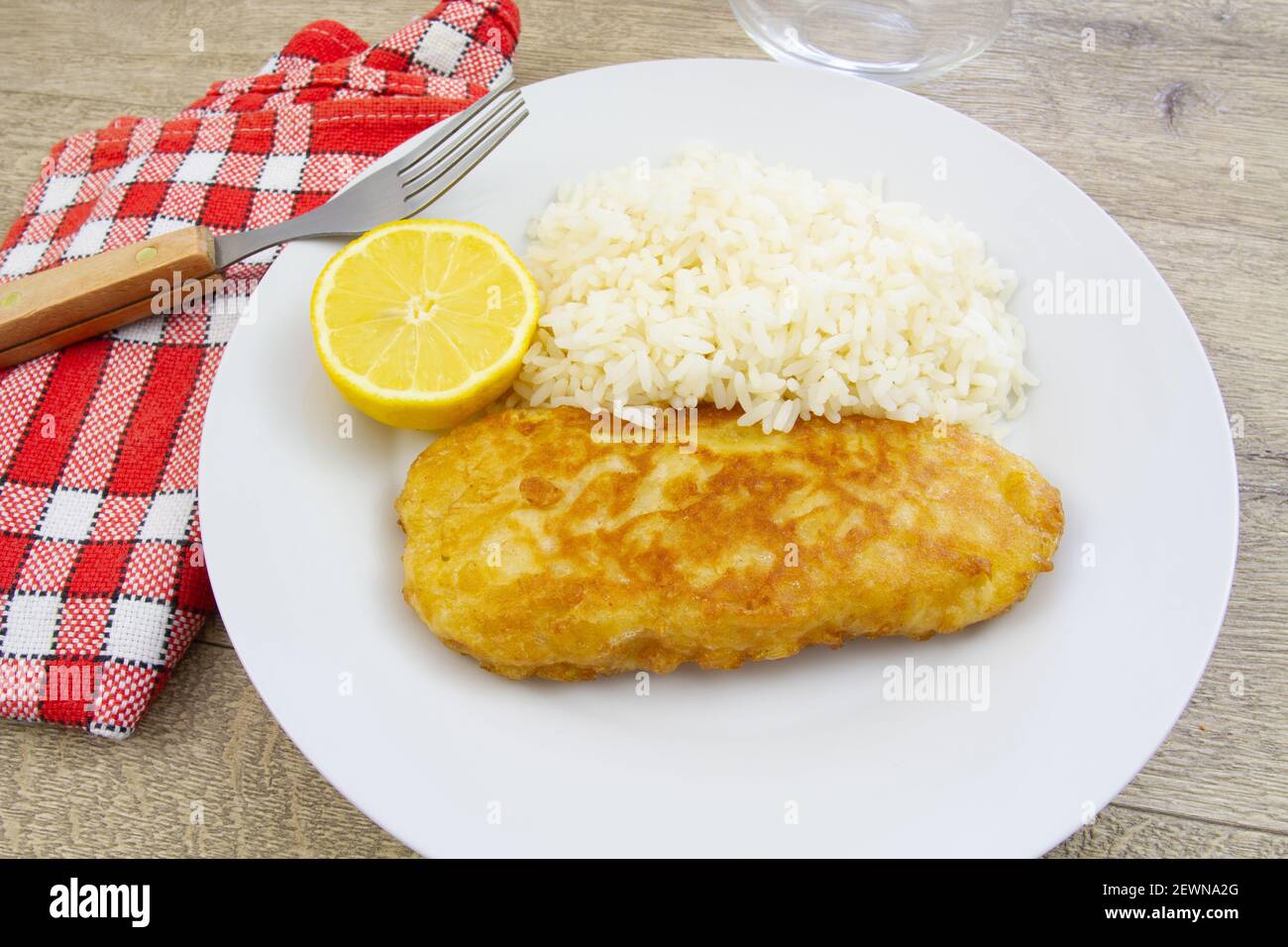 breaded fish with rice Stock Photo - Alamy