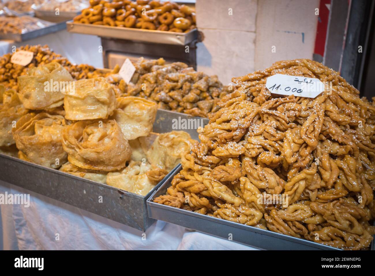 sale of cakes in a souk Stock Photo - Alamy