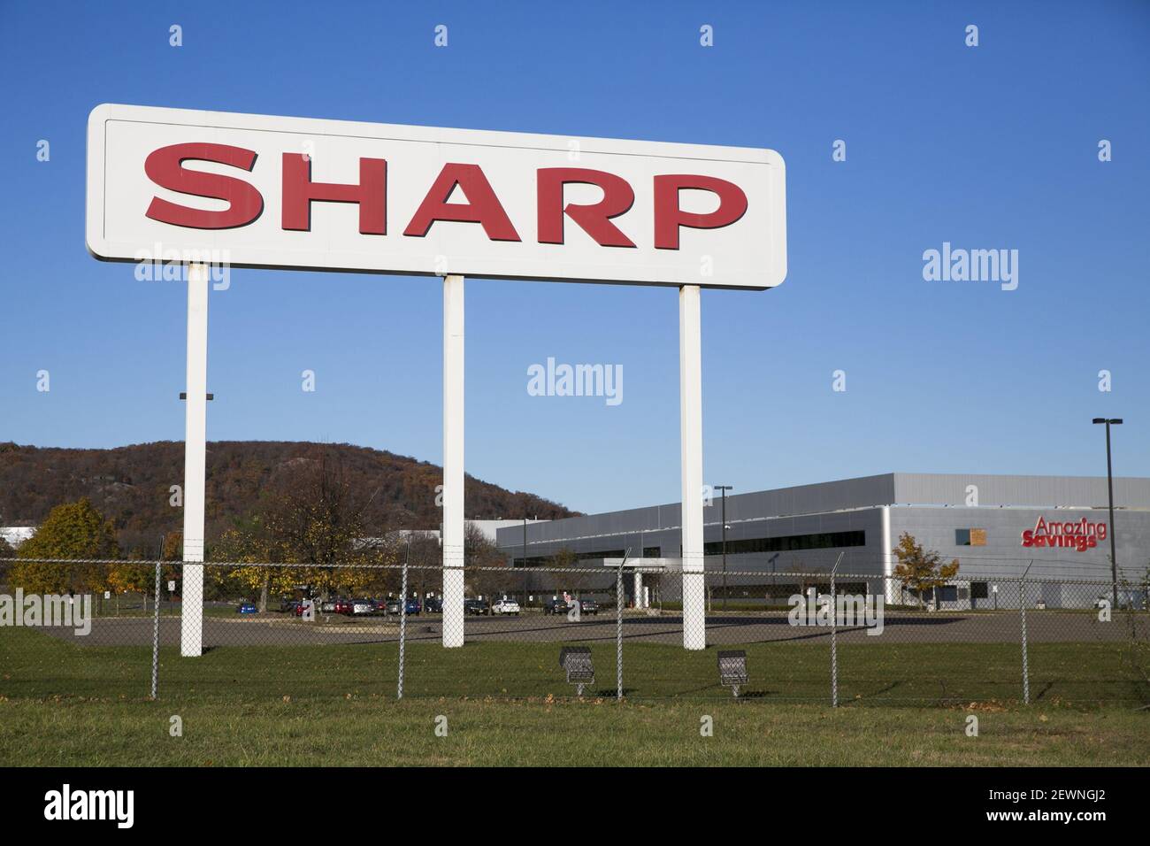 A logo sign outside of a facility occupied by the Sharp Corporation in ...
