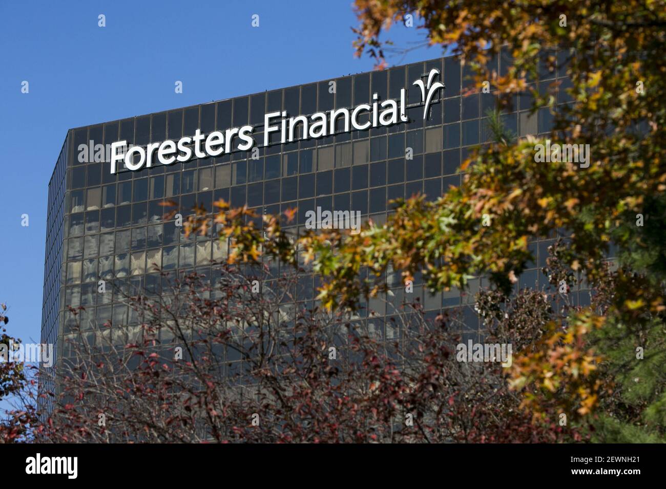 A logo sign outside of a facility occupied by Foresters Financial in ...