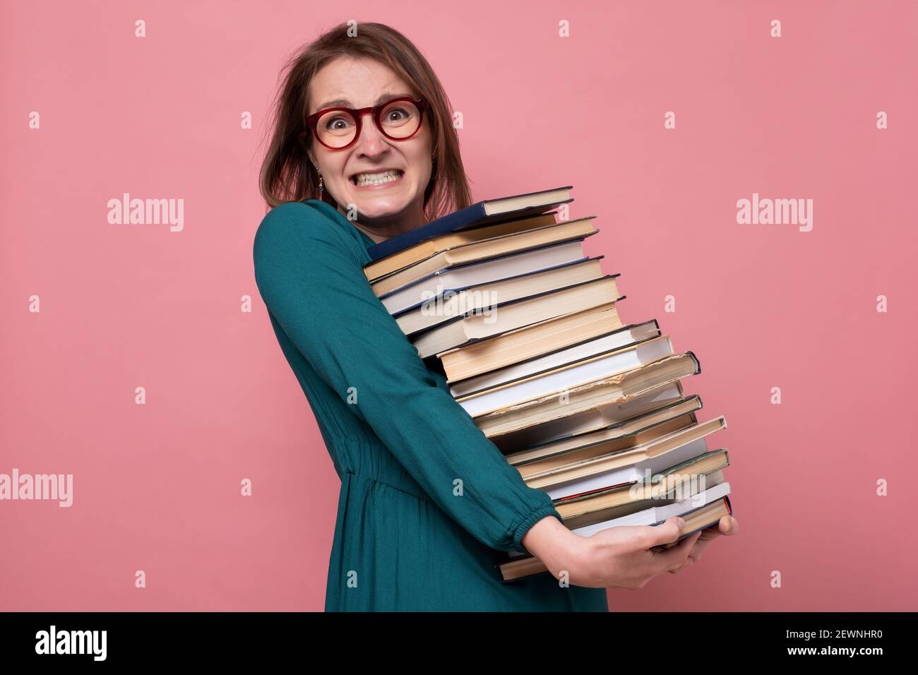 Beautiful woman reading many books hi-res stock photography and images ...