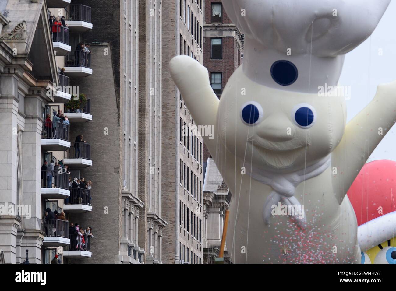 The Pillsbury Doughboy balloon makes its way down Central Park West ...
