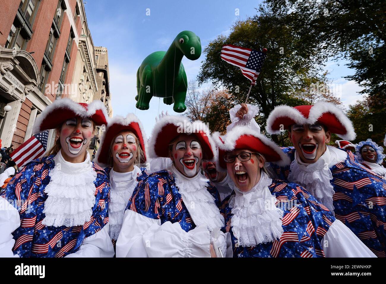 Parade clowns make their way down Central Park West during the 90th ...