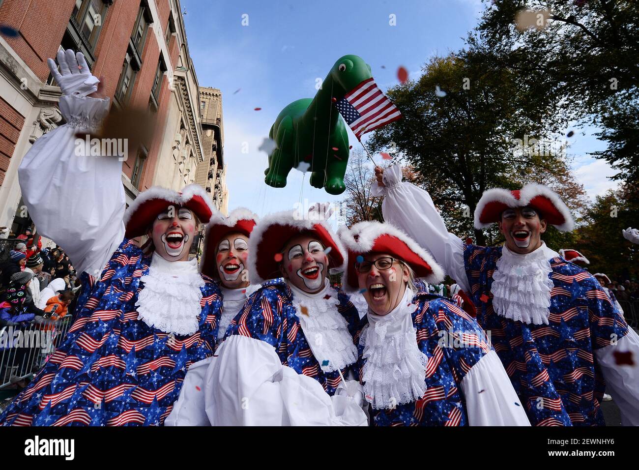 Parade clowns make their way down Central Park West during the 90th ...