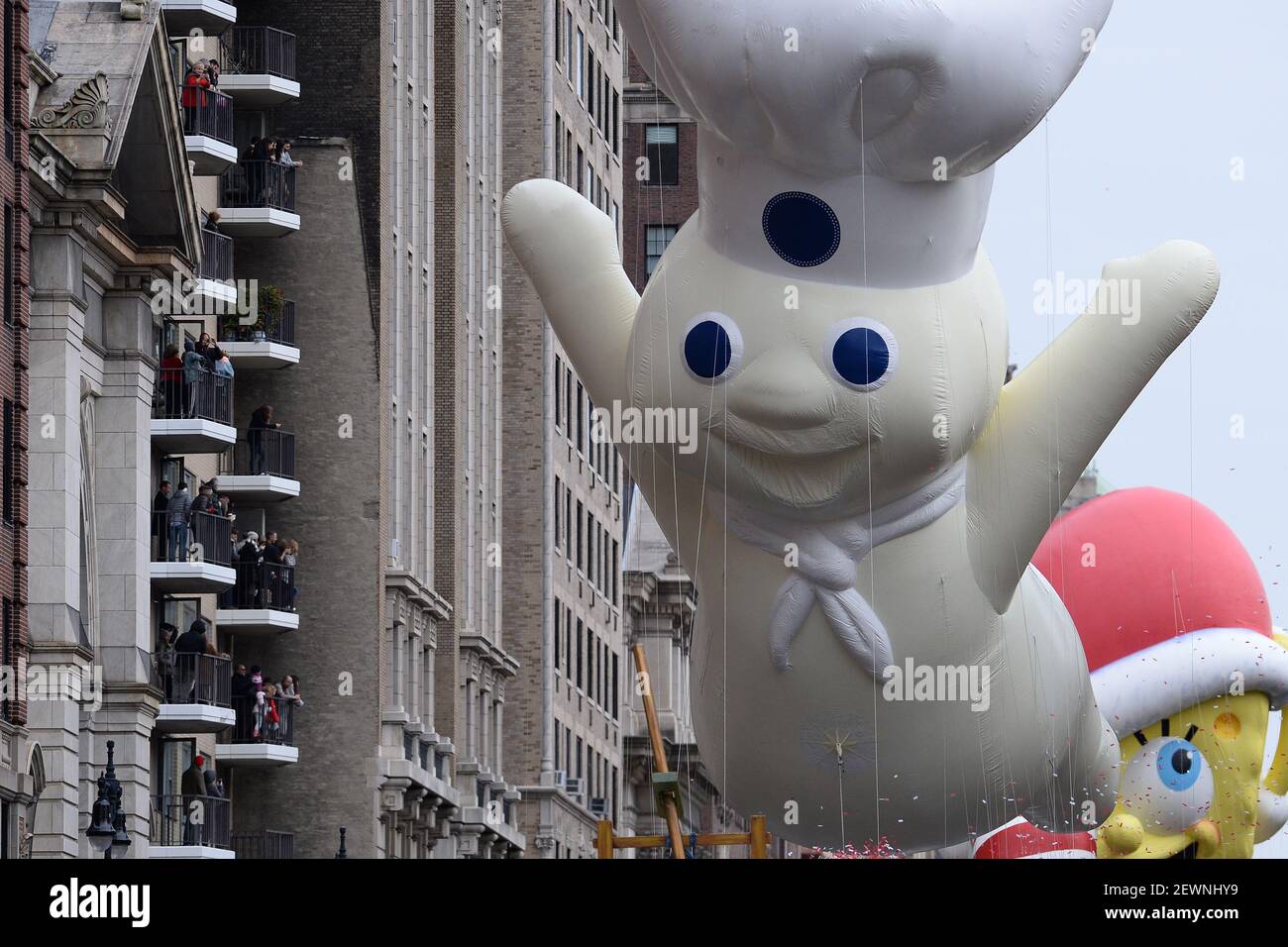 The Pillsbury Doughboy balloon makes its way down Central Park West ...