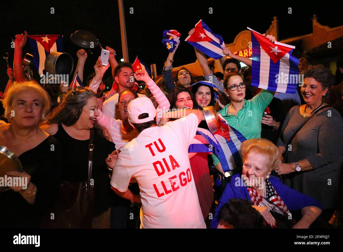 Cuban community in Miami celebrating the announcement that Fidel Castro ...