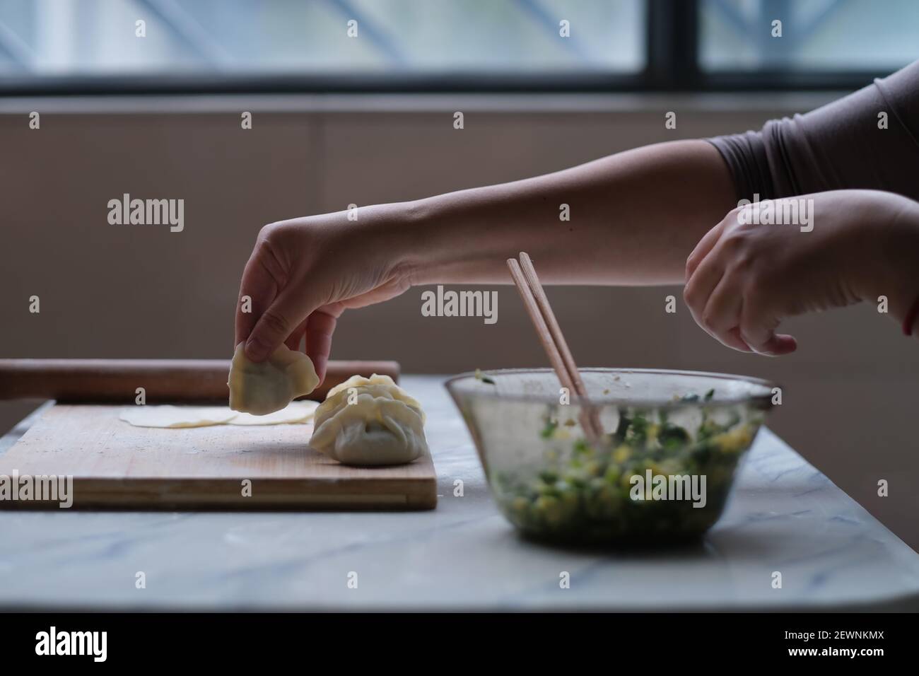 close up hand making dumpling. Traditional Chinese food during Chinese ...