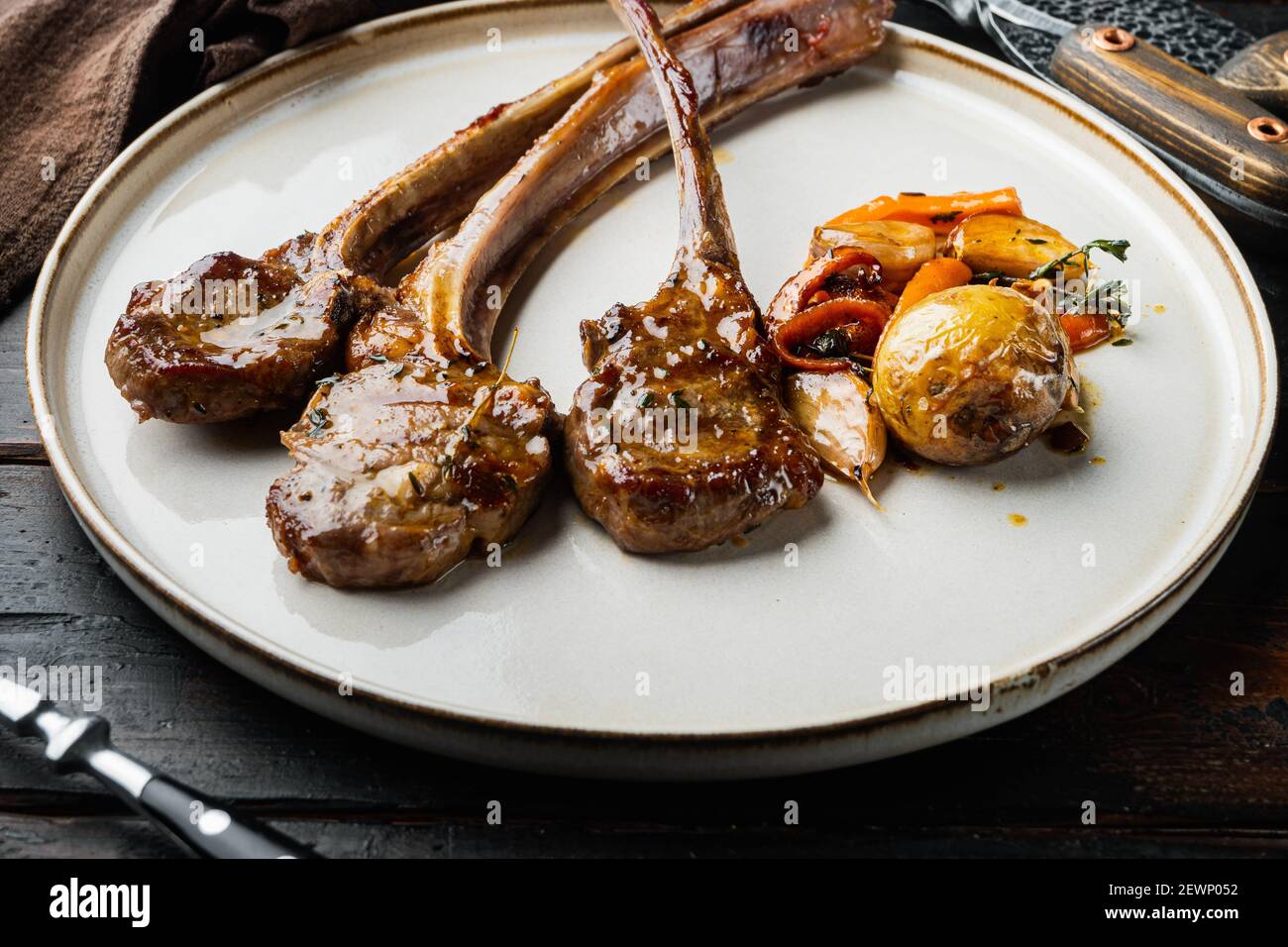 Sticky Lamb Chops with orange and carrot set, on plate Stock Photo - Alamy