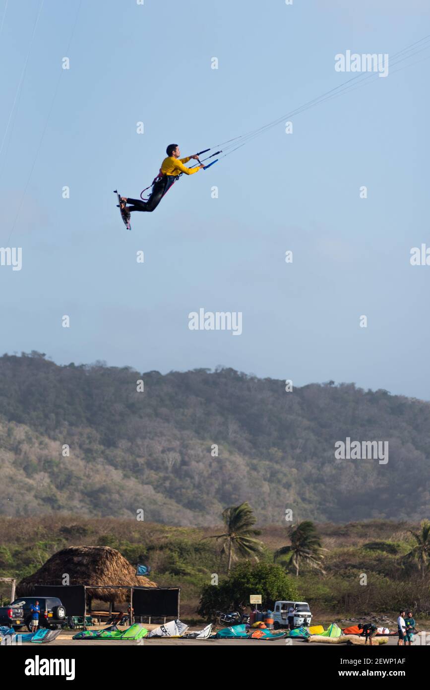 kite-surfing man jumping at kitesurf. kitesurfer athlete performing ...
