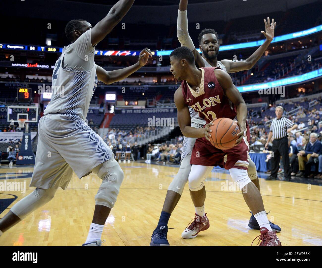 Elon guard Christian Hariston (12) looks to pass against Georgetown ...