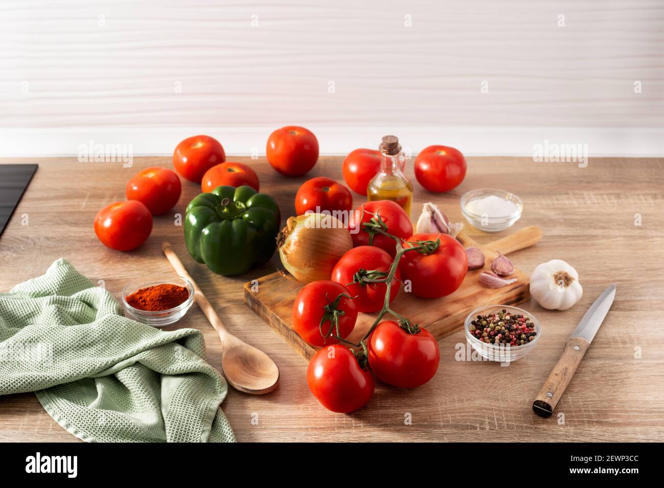 Ingredients to make tomato sauce on the kitchen counter Stock Photo - Alamy