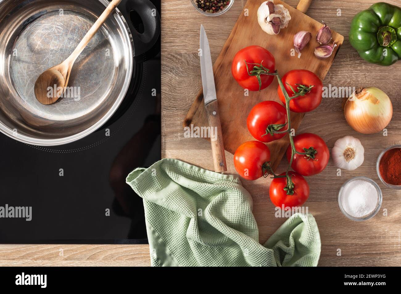 Ingredients to make tomato sauce on the kitchen counter Stock Photo - Alamy